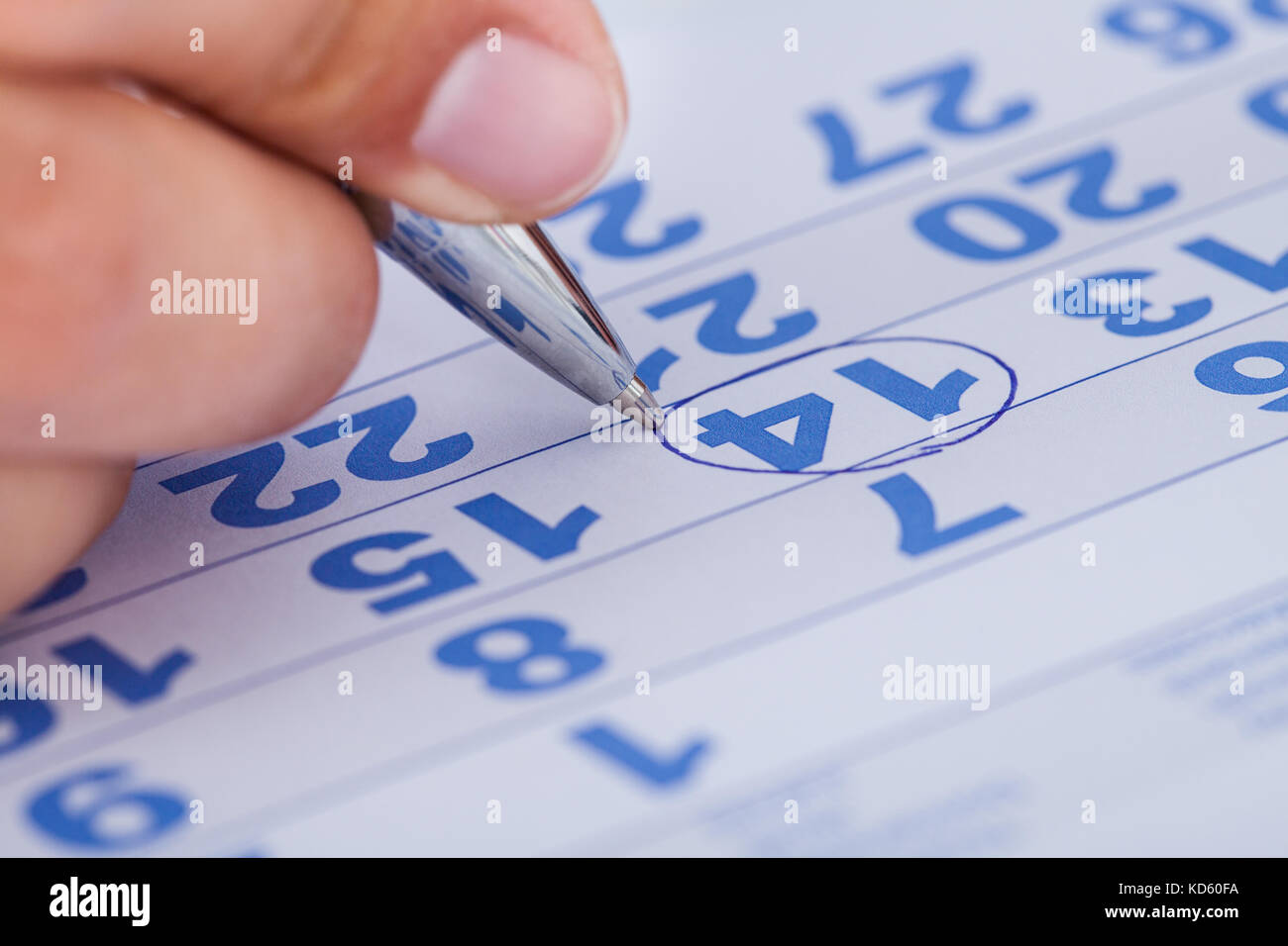 Close-up Of Man Highlighting Date On Calendar Stock Photo - Alamy