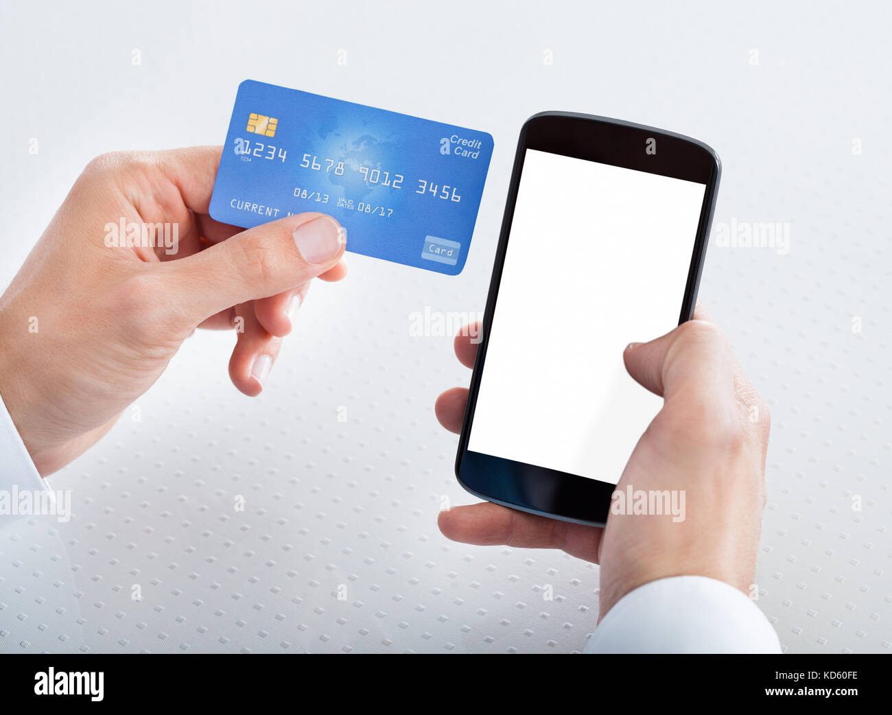 Man Holding Credit Card And Cell Phone Checking Account Balance Stock ...