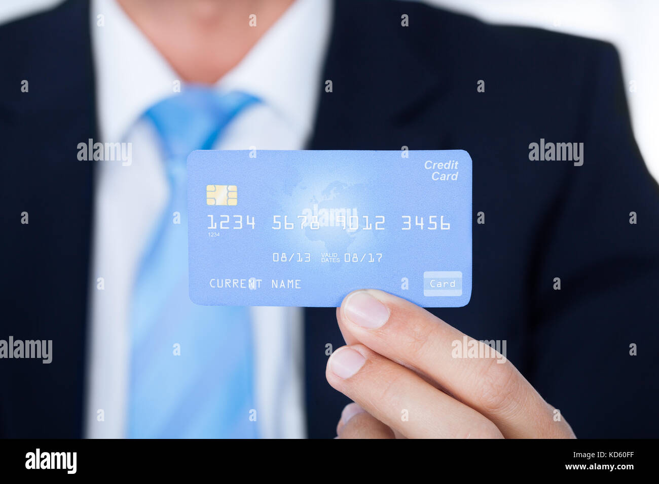 Portrait Of Young Happy Businessman Holding Credit Card Stock Photo - Alamy