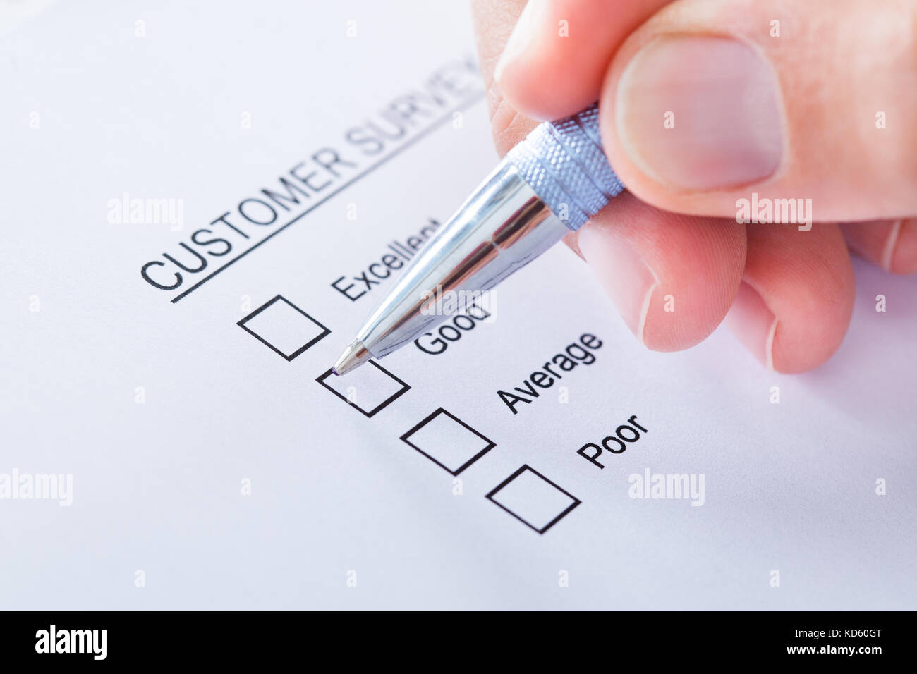 Close-up Of Human Hand Filling Customer Survey Form Stock Photo - Alamy