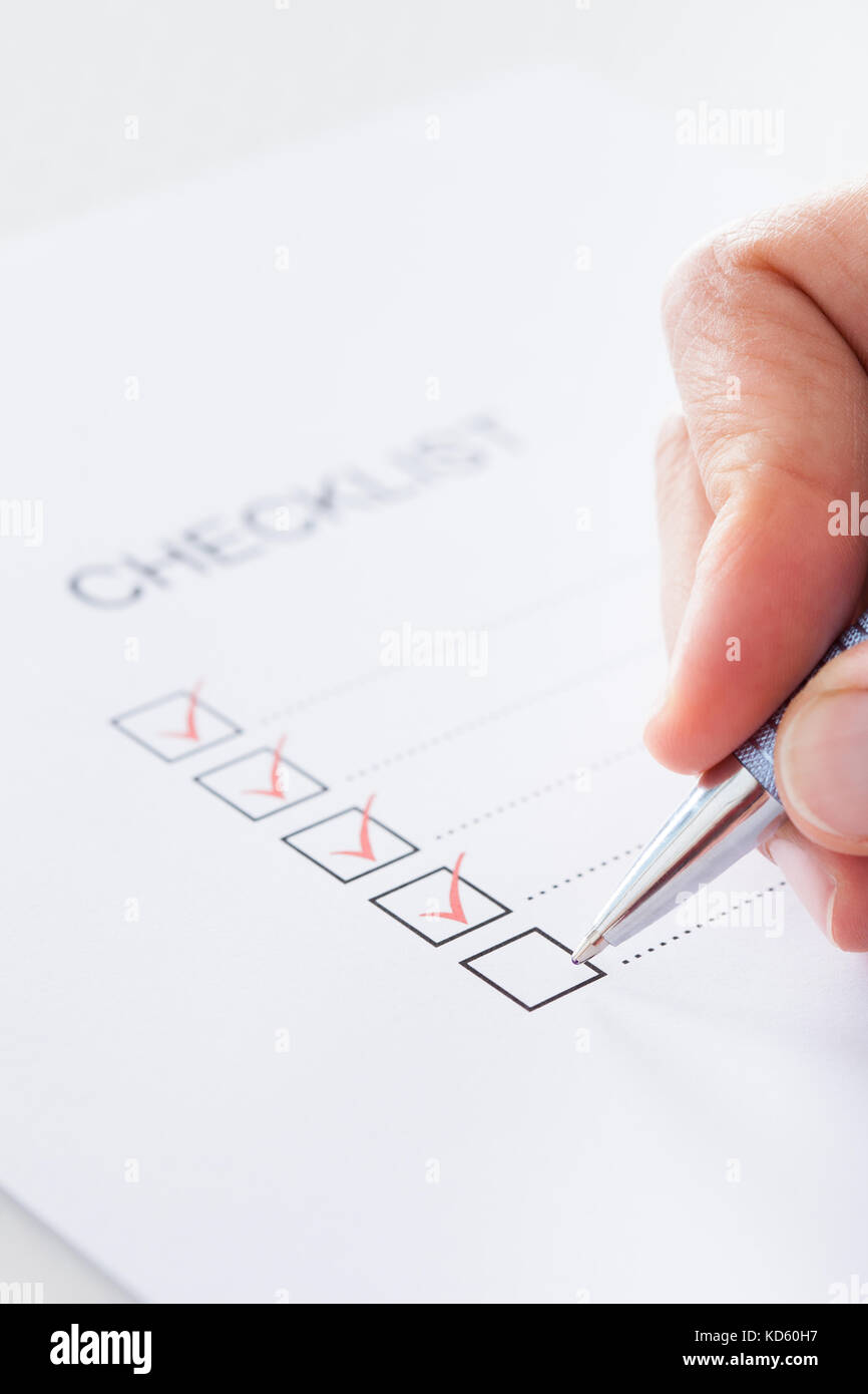 Close-up Of Human Hand Filling Check Boxes On Form Stock Photo - Alamy