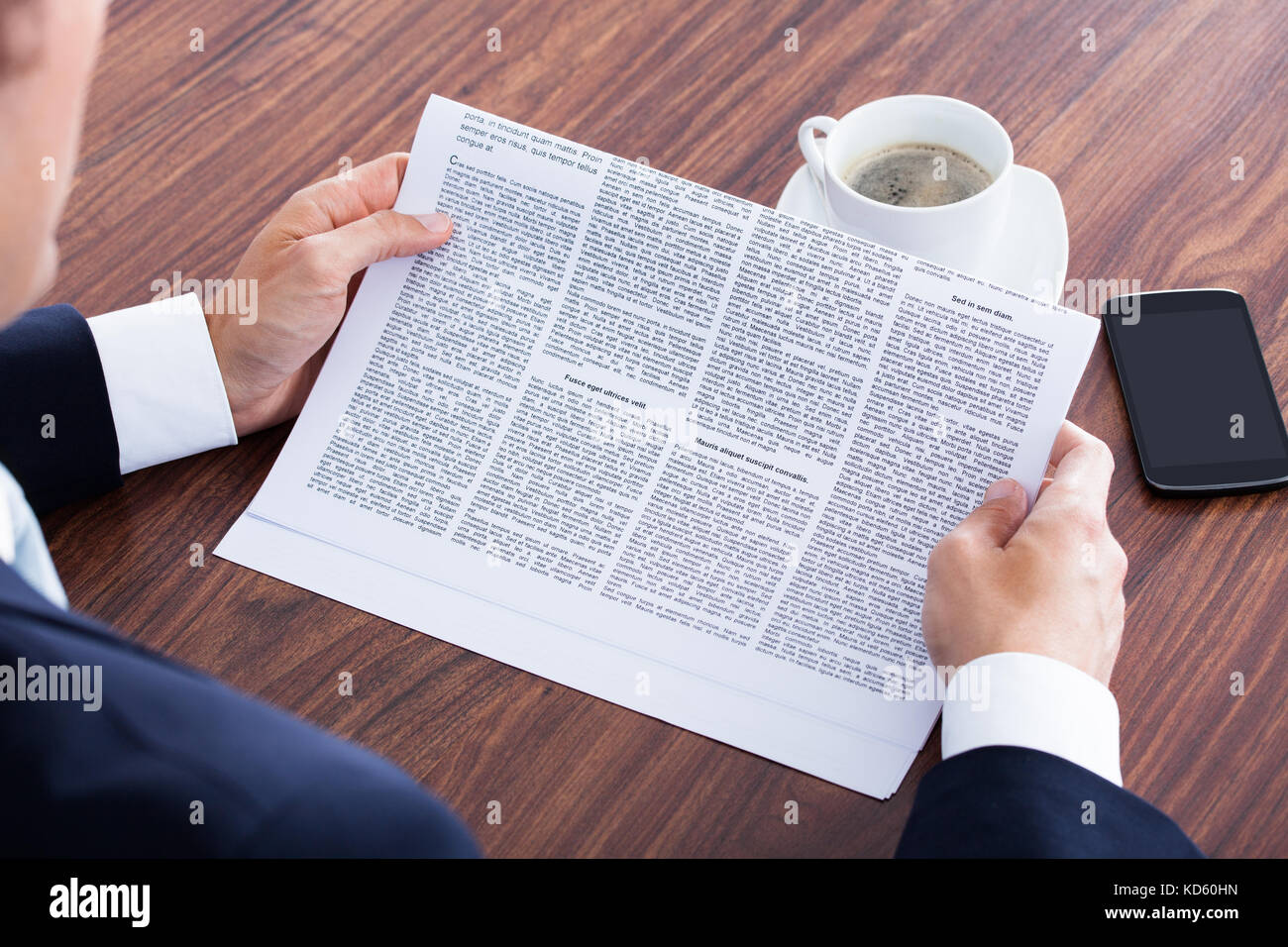Close-up Of Businessman Reading News On Newspaper Stock Photo - Alamy