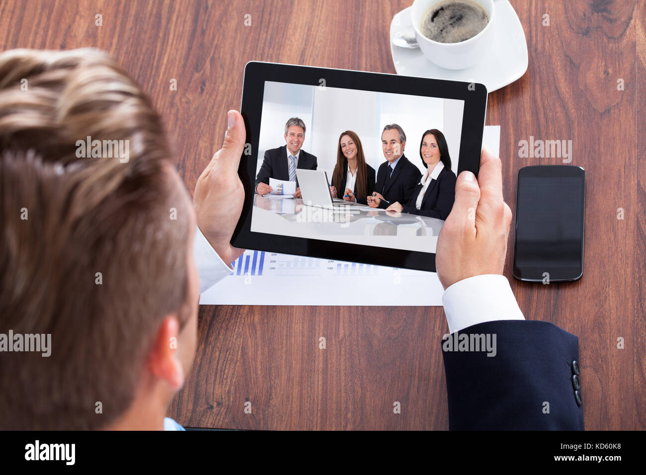 Businessman Video Conferencing On Digital Tablet In Office Stock Photo ...
