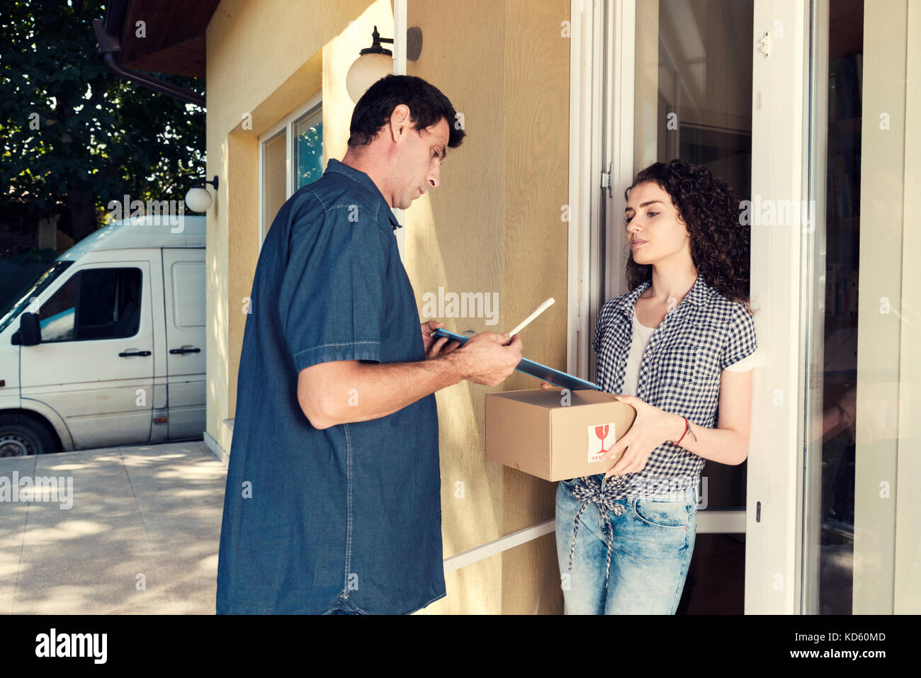 Delivery Supplier Girl Home Shopping Stock Photo - Alamy