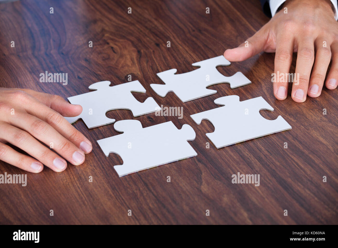 Completing jigsaw hi-res stock photography and images - Alamy