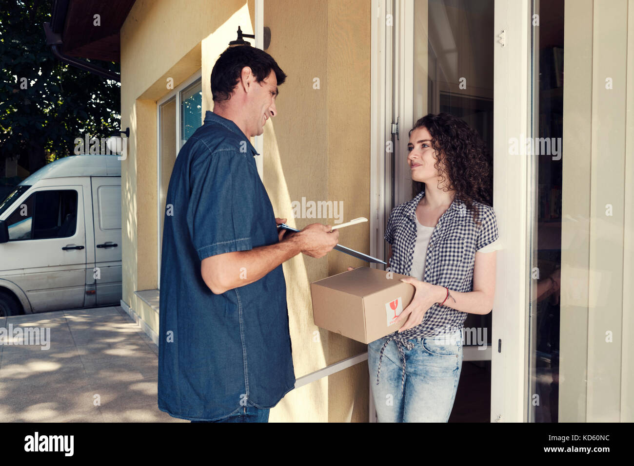 Smiling Girl Home Delivery Microbus Package Stock Photo - Alamy