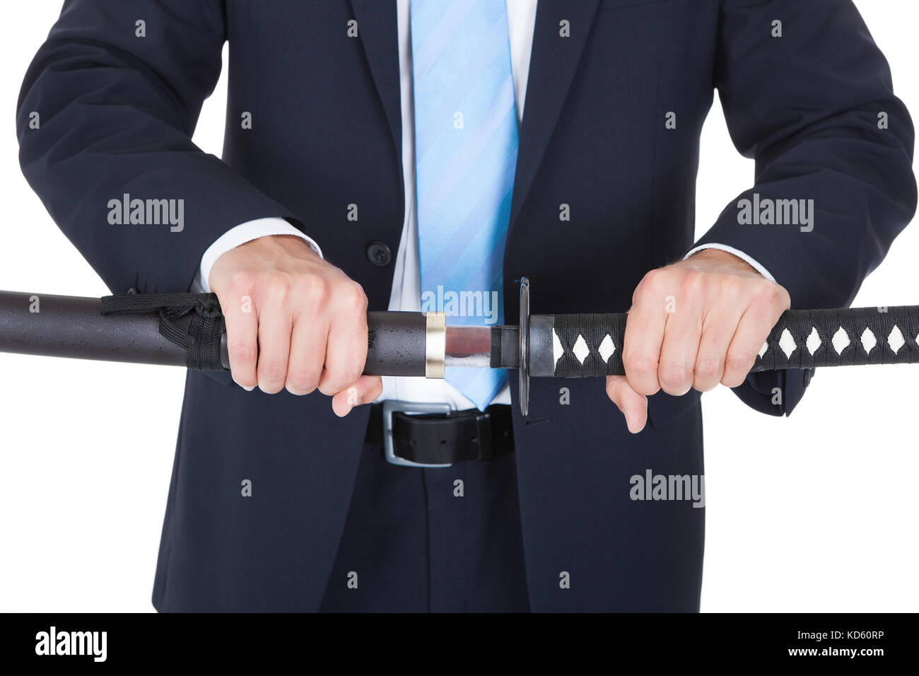 Close-up Of Businessman Removing Sword Over White Background Stock ...