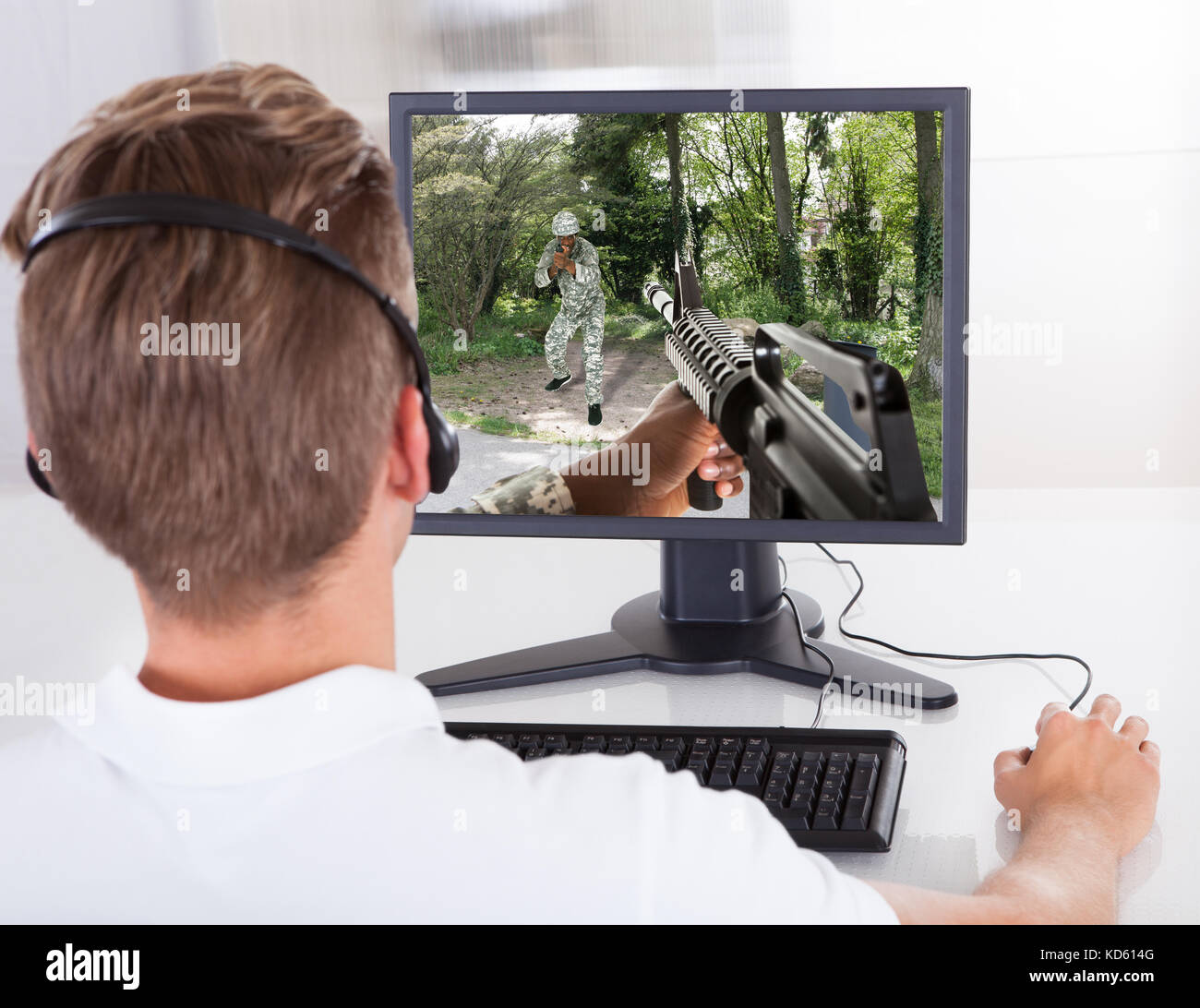Photo Of Young Man Playing Computer Games Stock Photo - Alamy