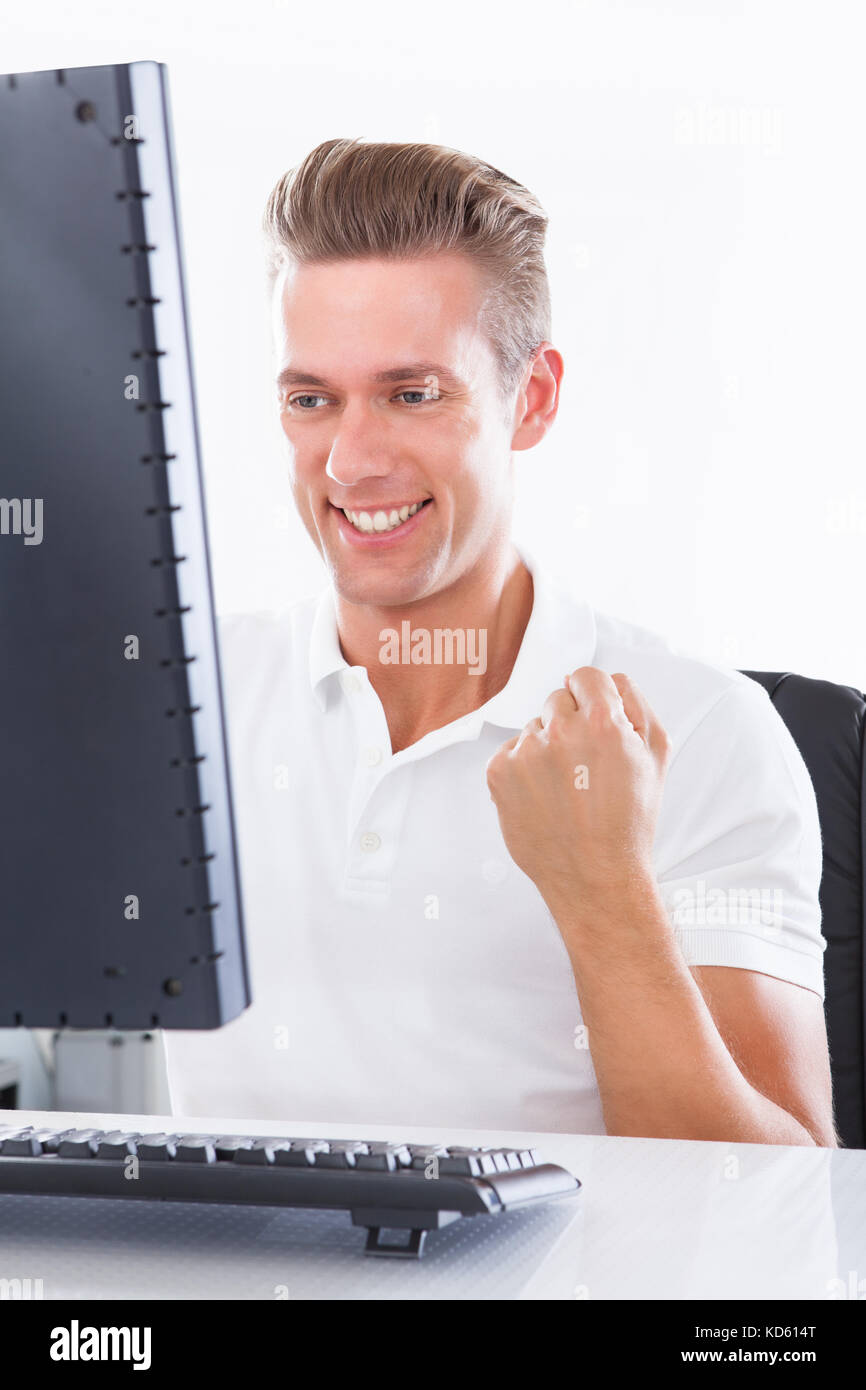 Happy Young Excited Man Using Computer Over White Background Stock ...