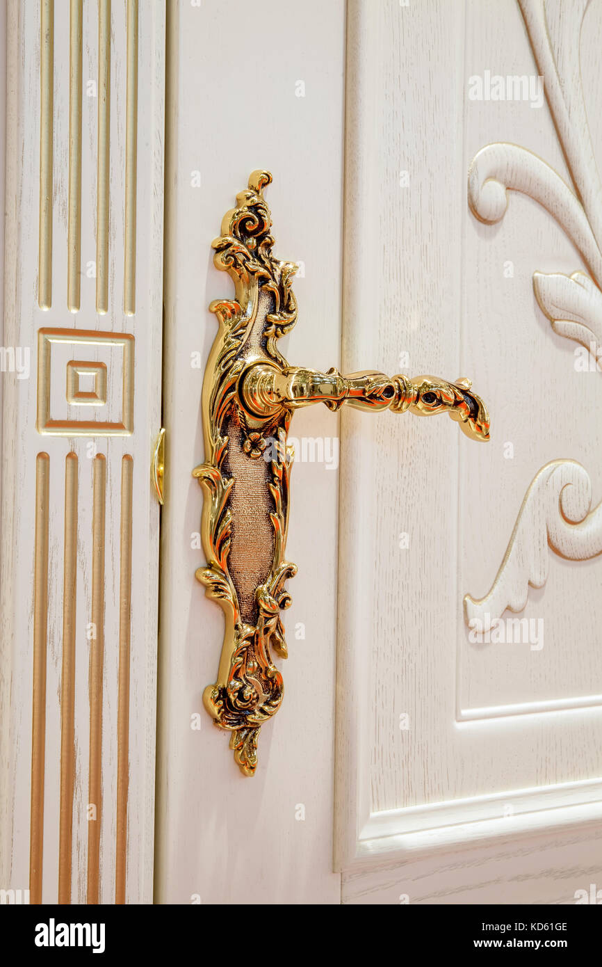 White door with golden lock Stock Photo - Alamy
