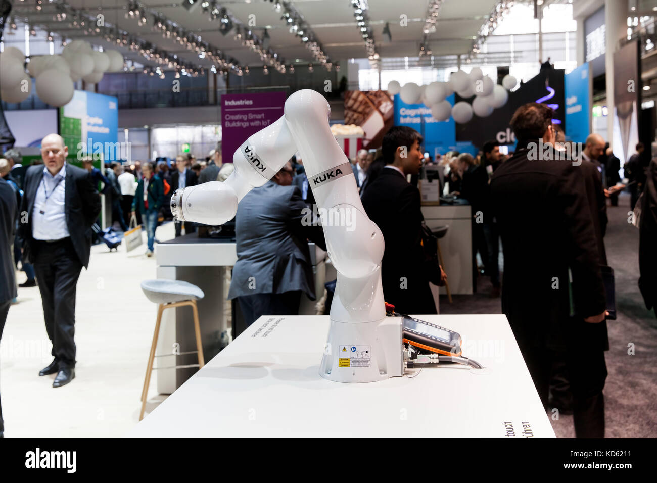 Kuka industrial robot hand in manufacturing industry on exhibition Cebit 2017 in Hannover Messe ...