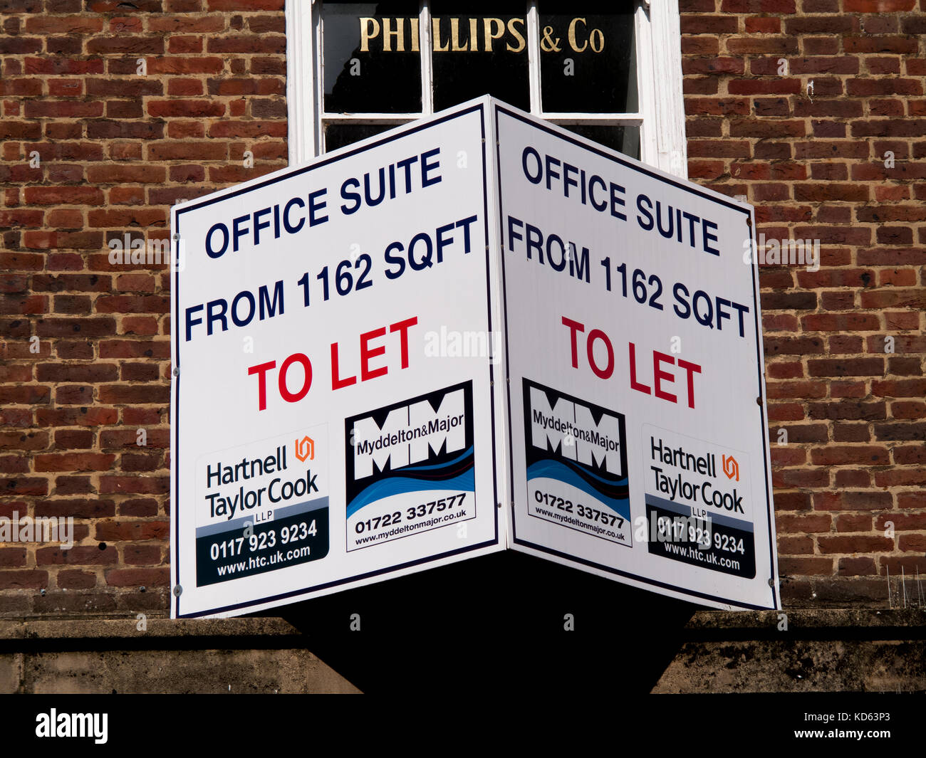 Estate agents office to let advertisement sign over vacant premises ...