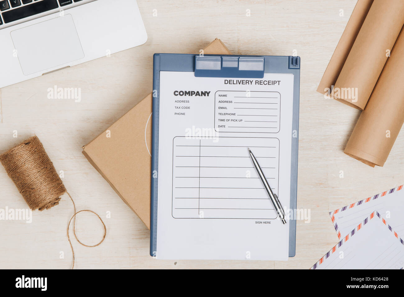 Delivery receipt on cardboard box at table Stock Photo - Alamy