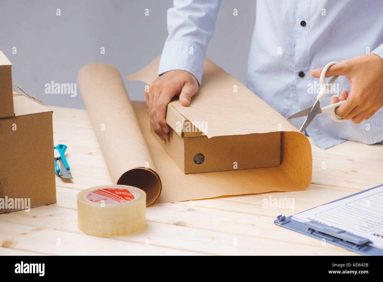 Delivery man packing up on work place in post office Stock Photo - Alamy
