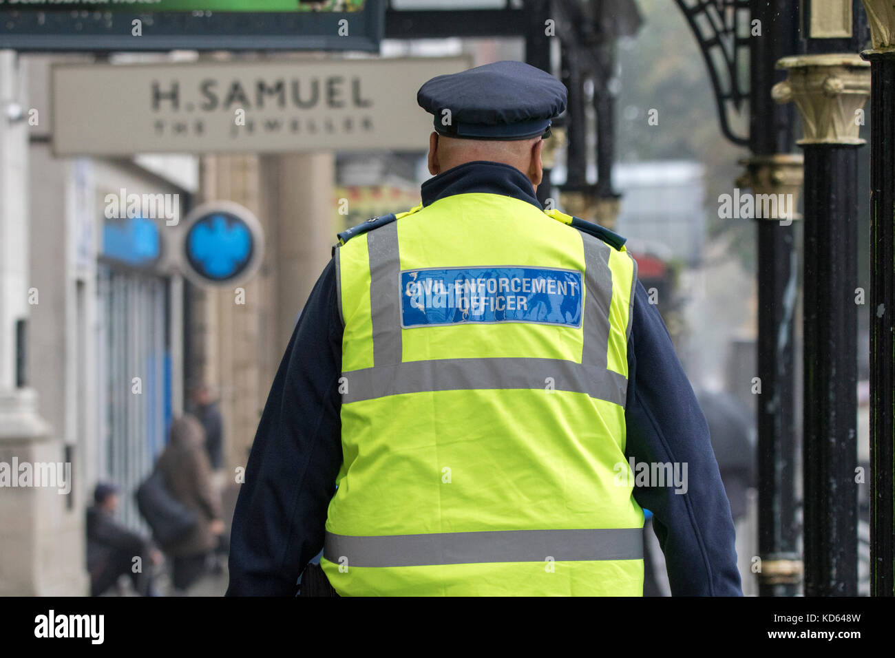 A civil enforcement officer patrolling the streets of Southport town ...