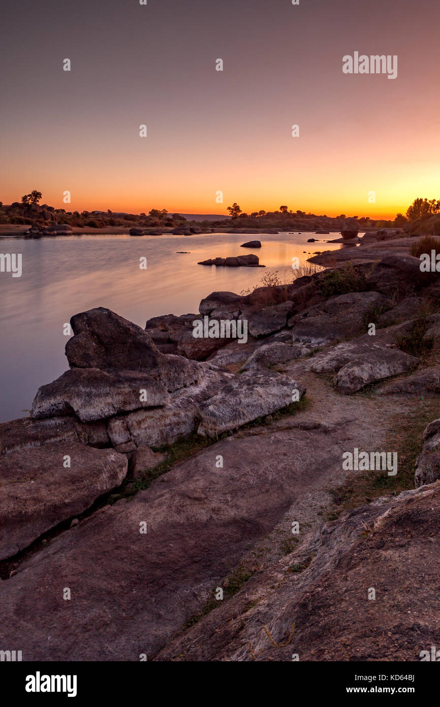 Beautiful landscape in a lake during the sunset with amazing colors ...