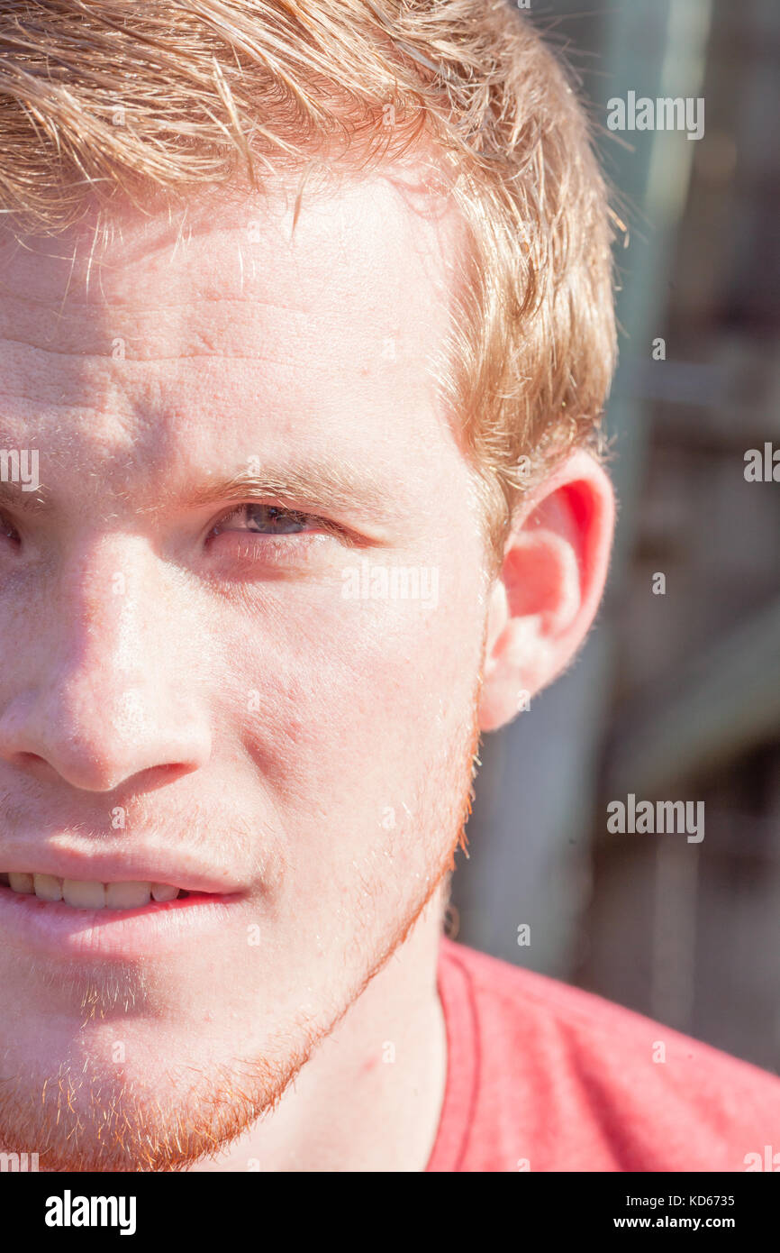 Young man half head vertical portrait at camera lens abstract ...
