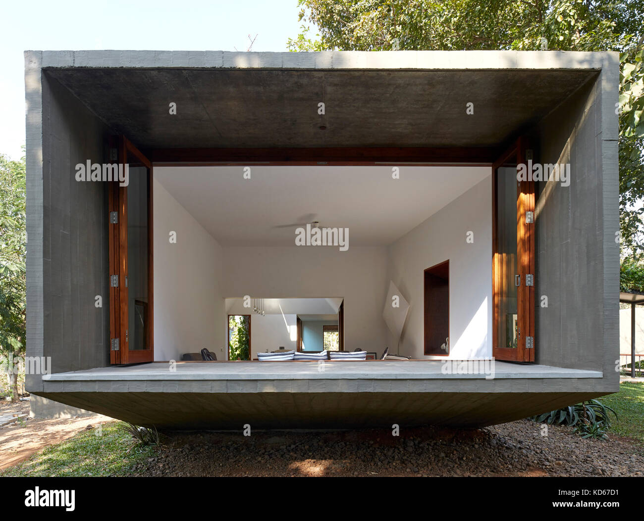 Overall view looking straight into concrete funnel. House on a stream ...
