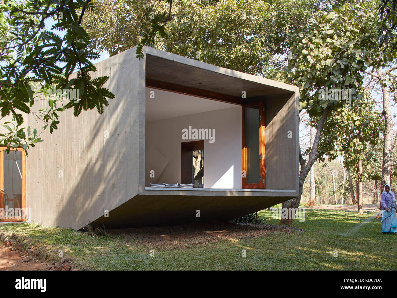 Overall view looking towards concrete funnel. House on a stream ...