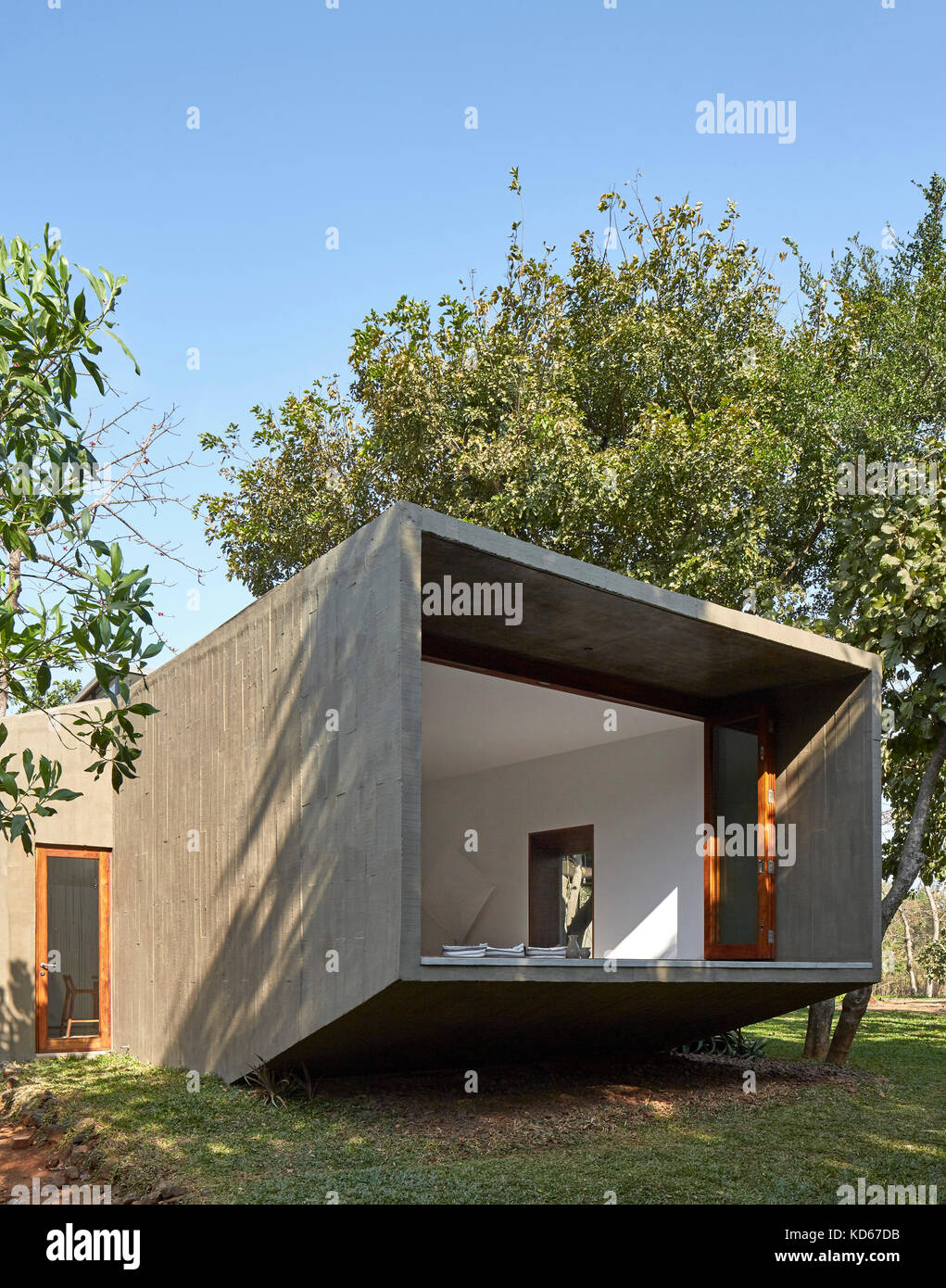 Overall view looking towards concrete funnel. House on a stream ...