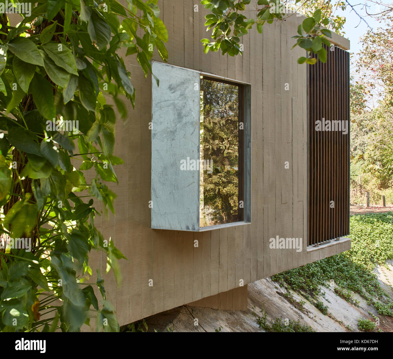 Side view with (empty) stream. House on a stream, Alibaug, India ...
