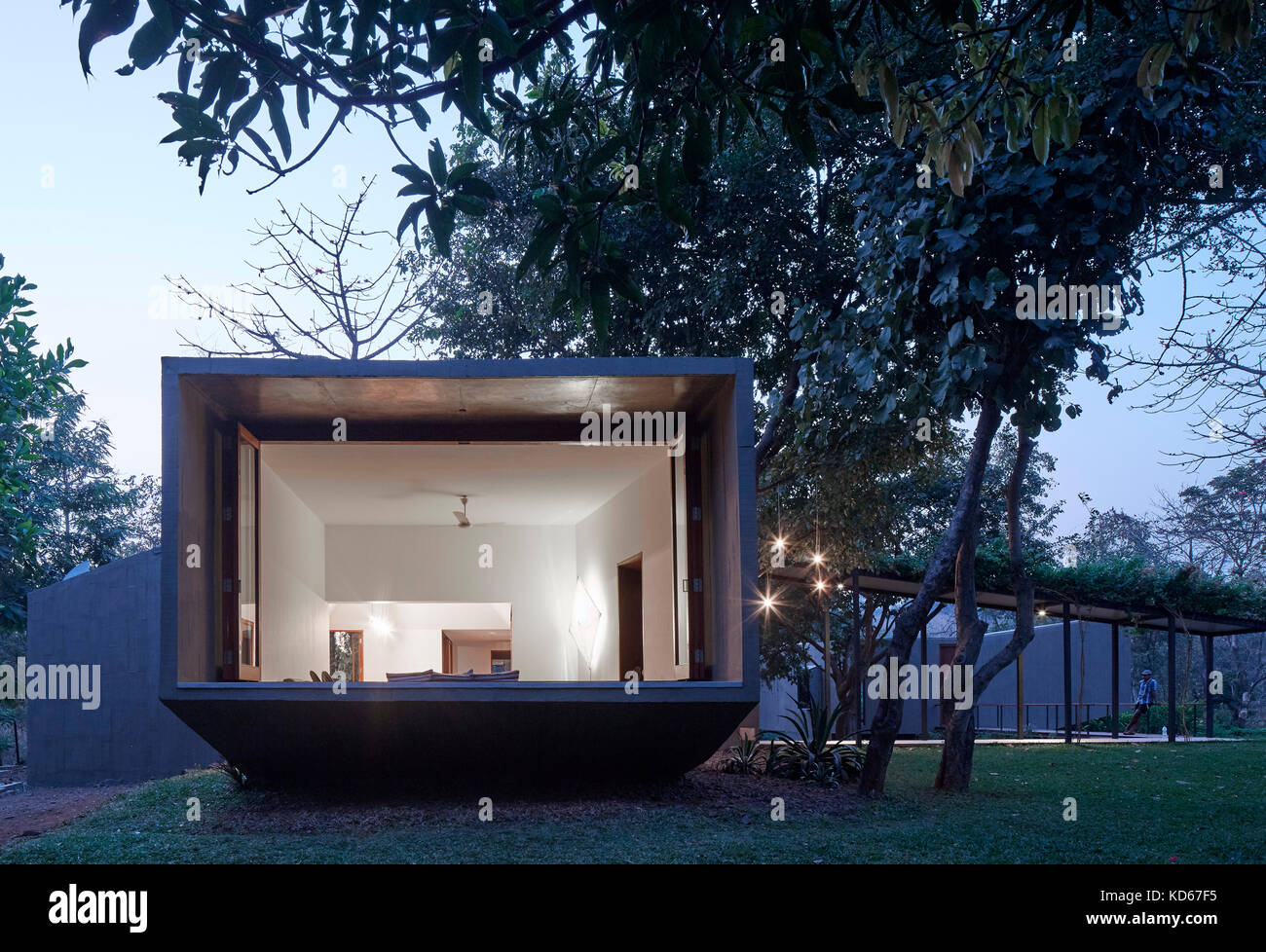Overall view looking straight into concrete funnel at dusk. House on a ...