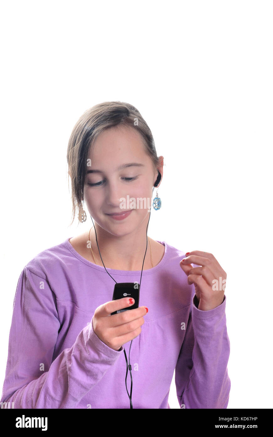 Girl listening to mp3 player Stock Photo - Alamy