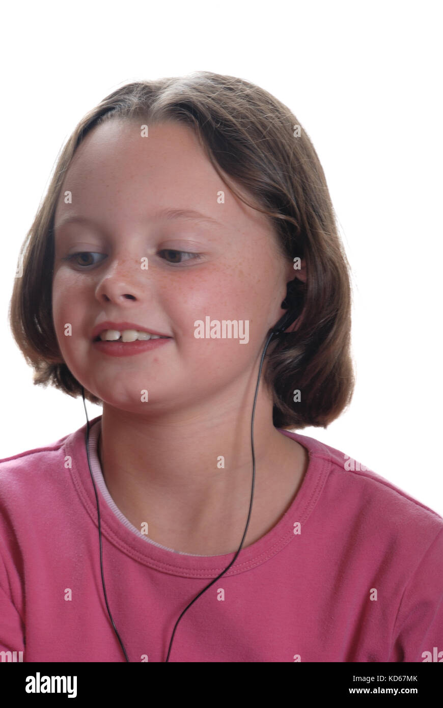 Girl listening to mp3 player Stock Photo - Alamy