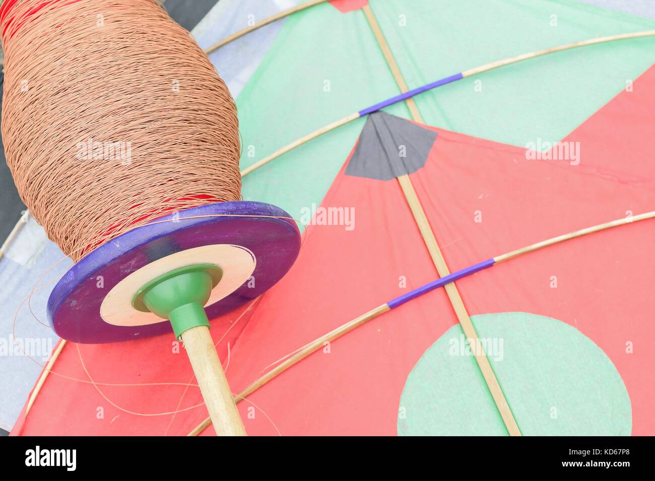 Background of colorful Indian Kite with threads called Manjha in ...