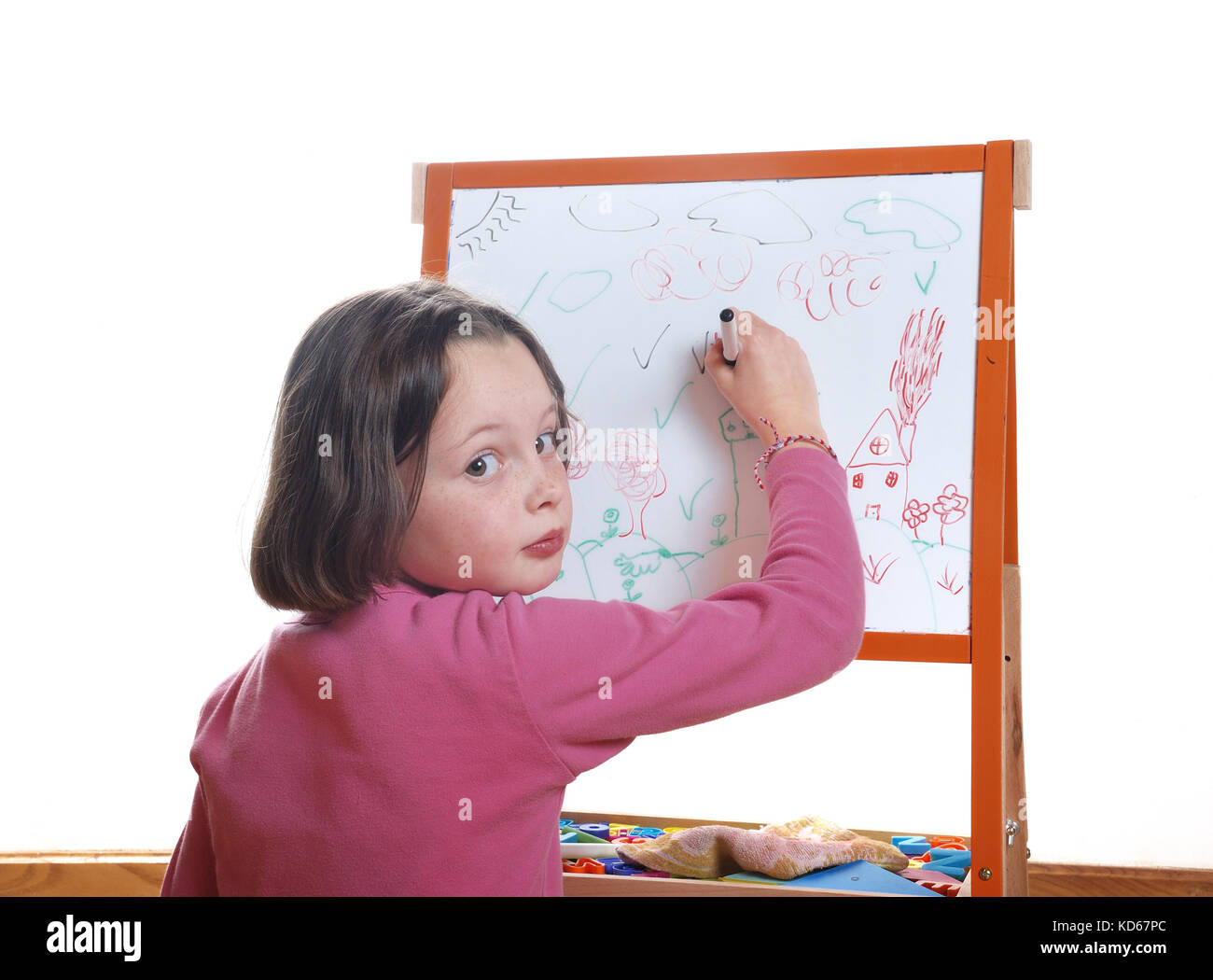 Young girl drawing on the white board Stock Photo - Alamy