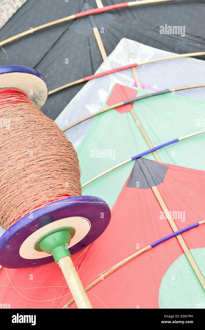 Background of colorful Indian Kite with threads called Manjha in ...