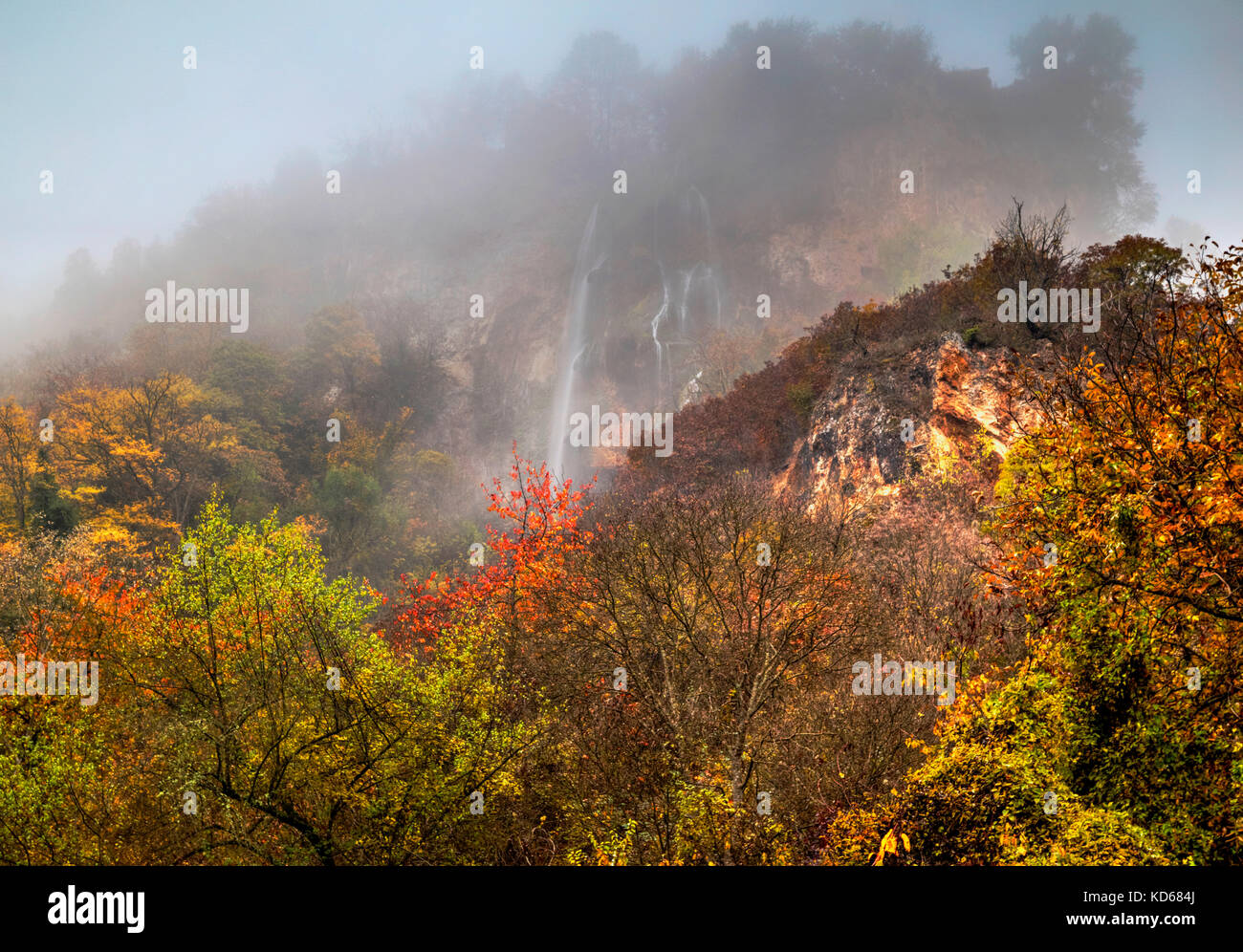 Beautiful landscape with mountain waterfall and colorful autumn forest ...