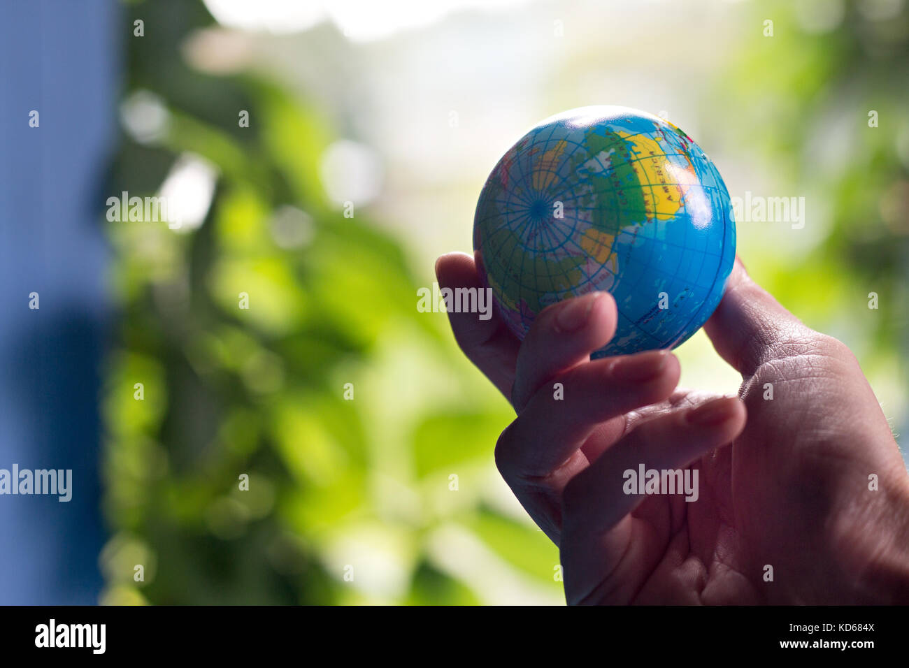 woman's hand with globe Stock Photo - Alamy