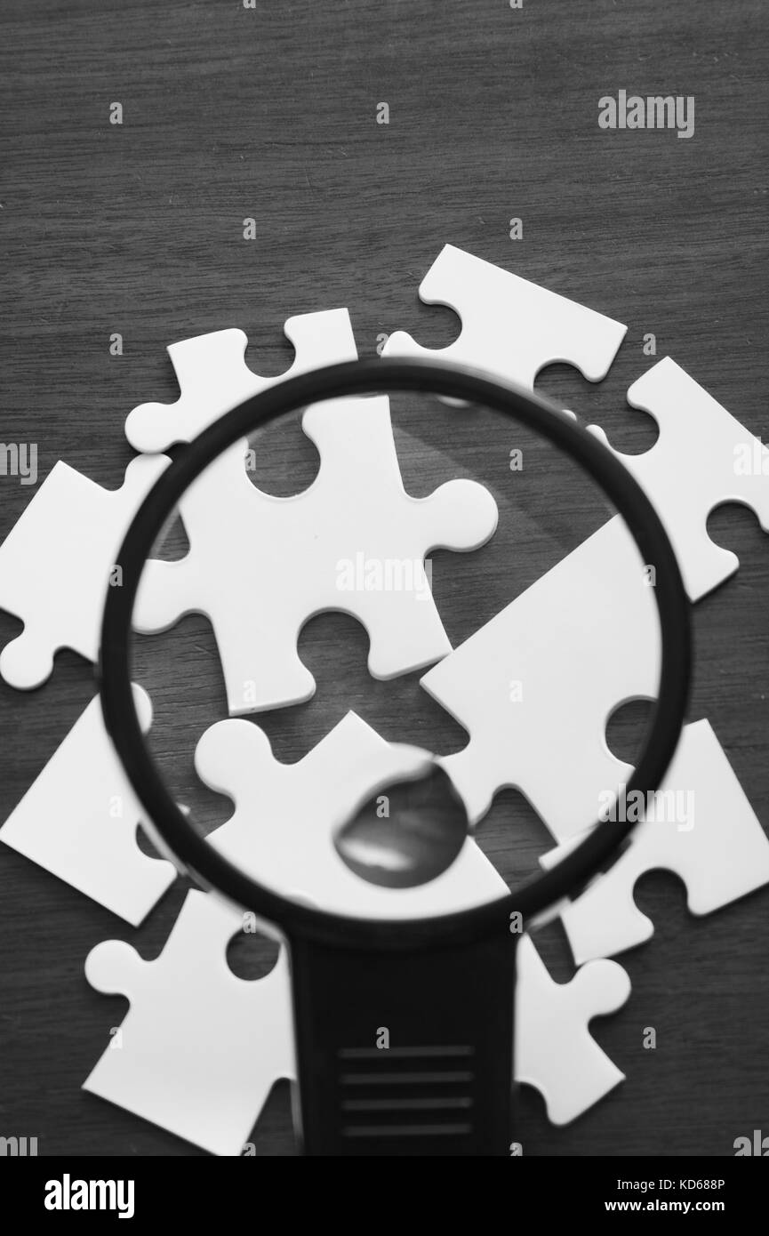 Magnifying Glass and Puzzle Stock Photo - Alamy