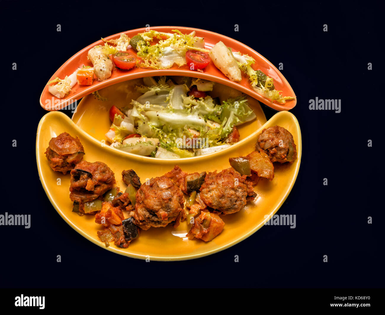 Meatball and salad . Healthy food on original plate Stock Photo - Alamy