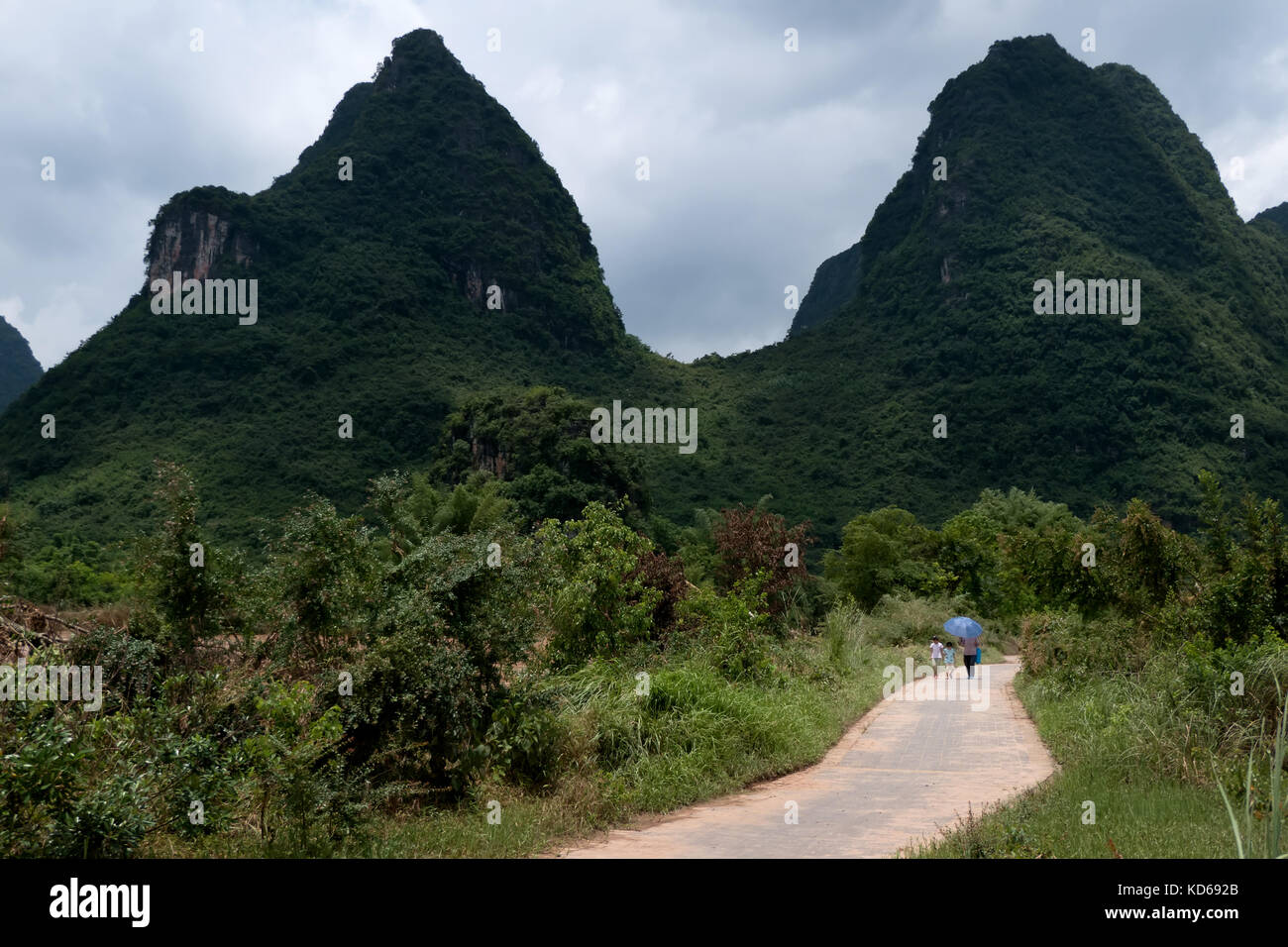 Chinese woman and children walking. Natural landscape and countryside ...