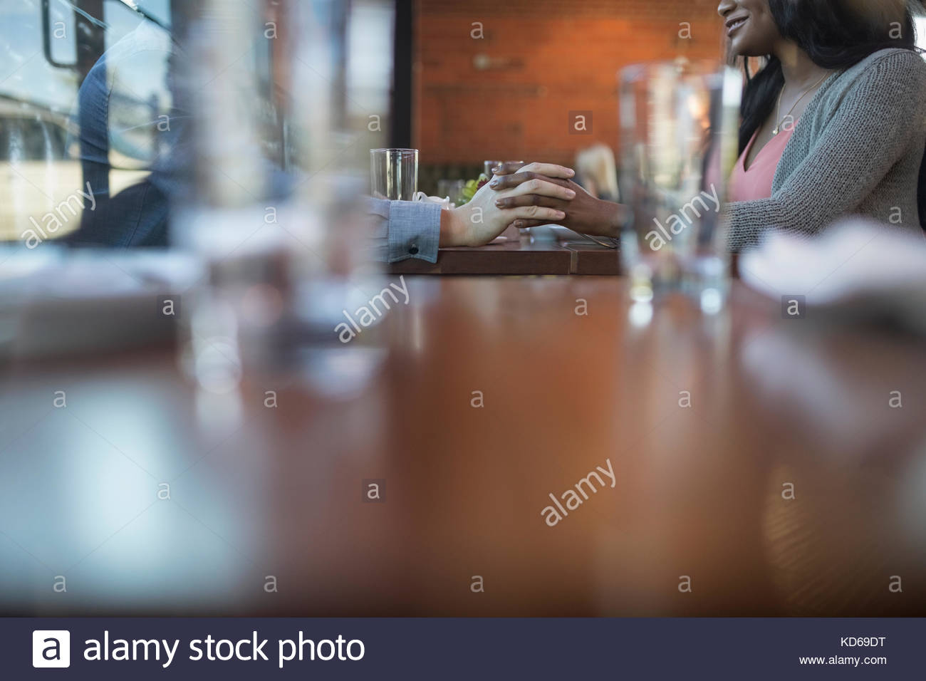 Affectionate couple holding hands hi-res stock photography and images ...