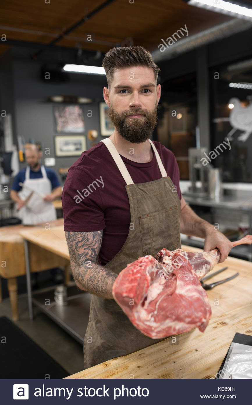 Young man holding lamb hi-res stock photography and images - Alamy