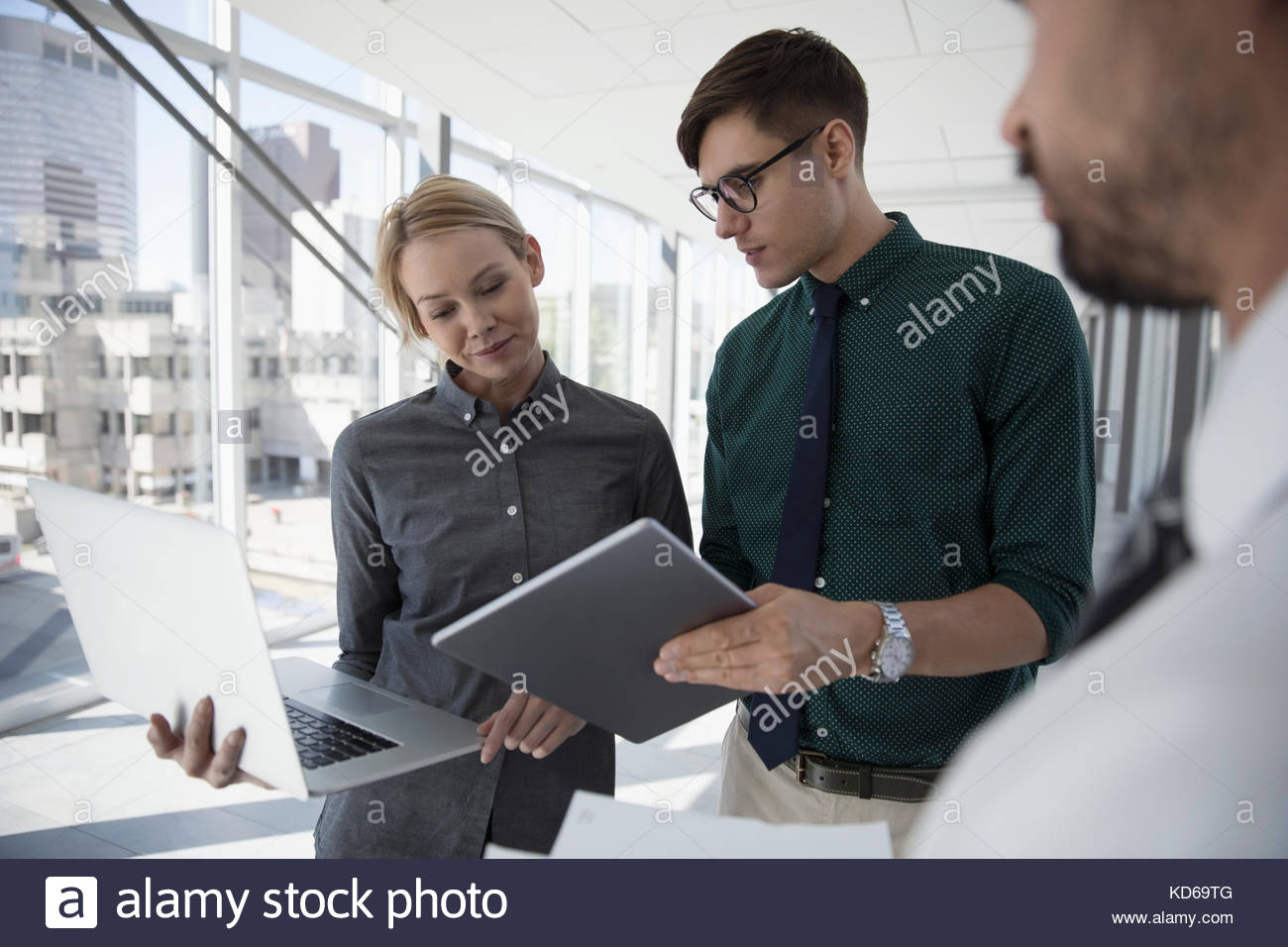 Business people using digital tablet and laptop in office Stock Photo ...