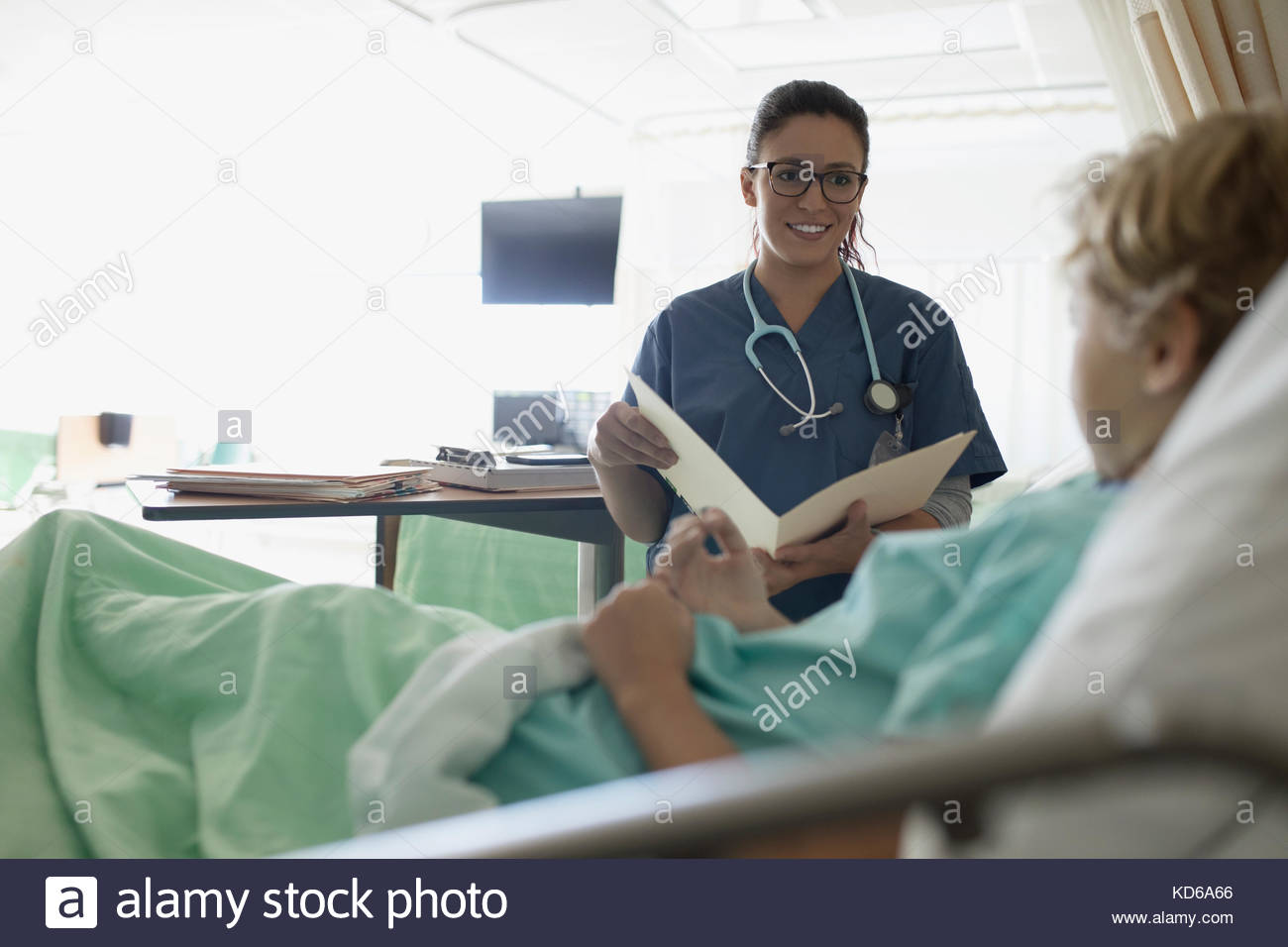 Female nurse patient hospital bed hi-res stock photography and images ...