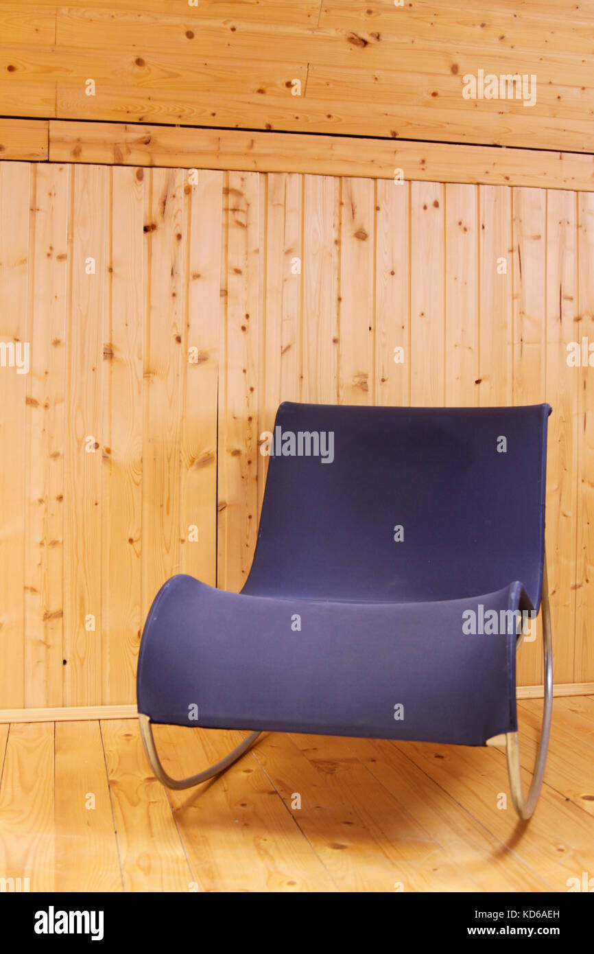 Blue chair in wooden minimalist interior Stock Photo - Alamy