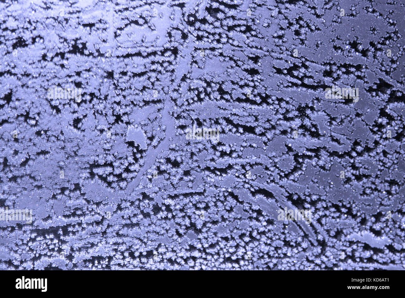 Dark blue frozen window glass background Stock Photo - Alamy