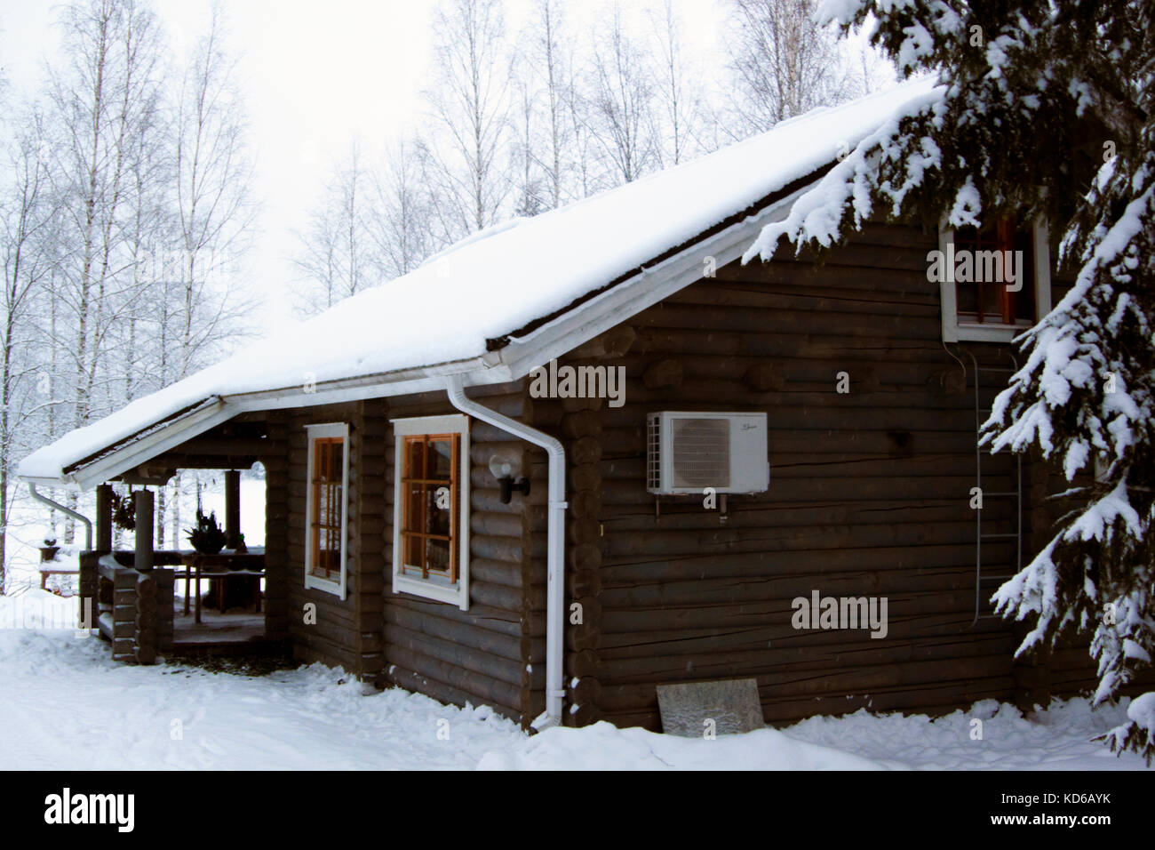 wooden cottage covered by snow Stock Photo - Alamy