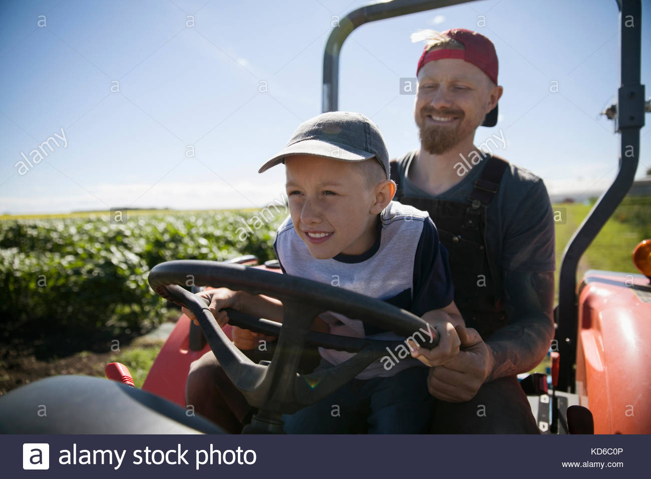 Man sitting on tractor hi-res stock photography and images - Alamy