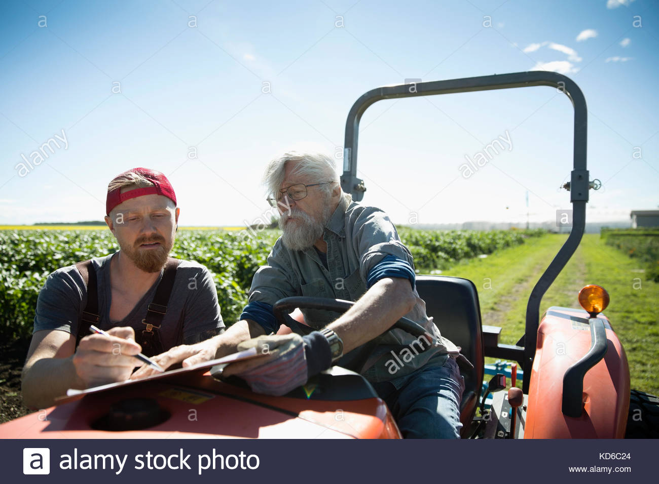 Family sitting on a tractor hi-res stock photography and images - Alamy