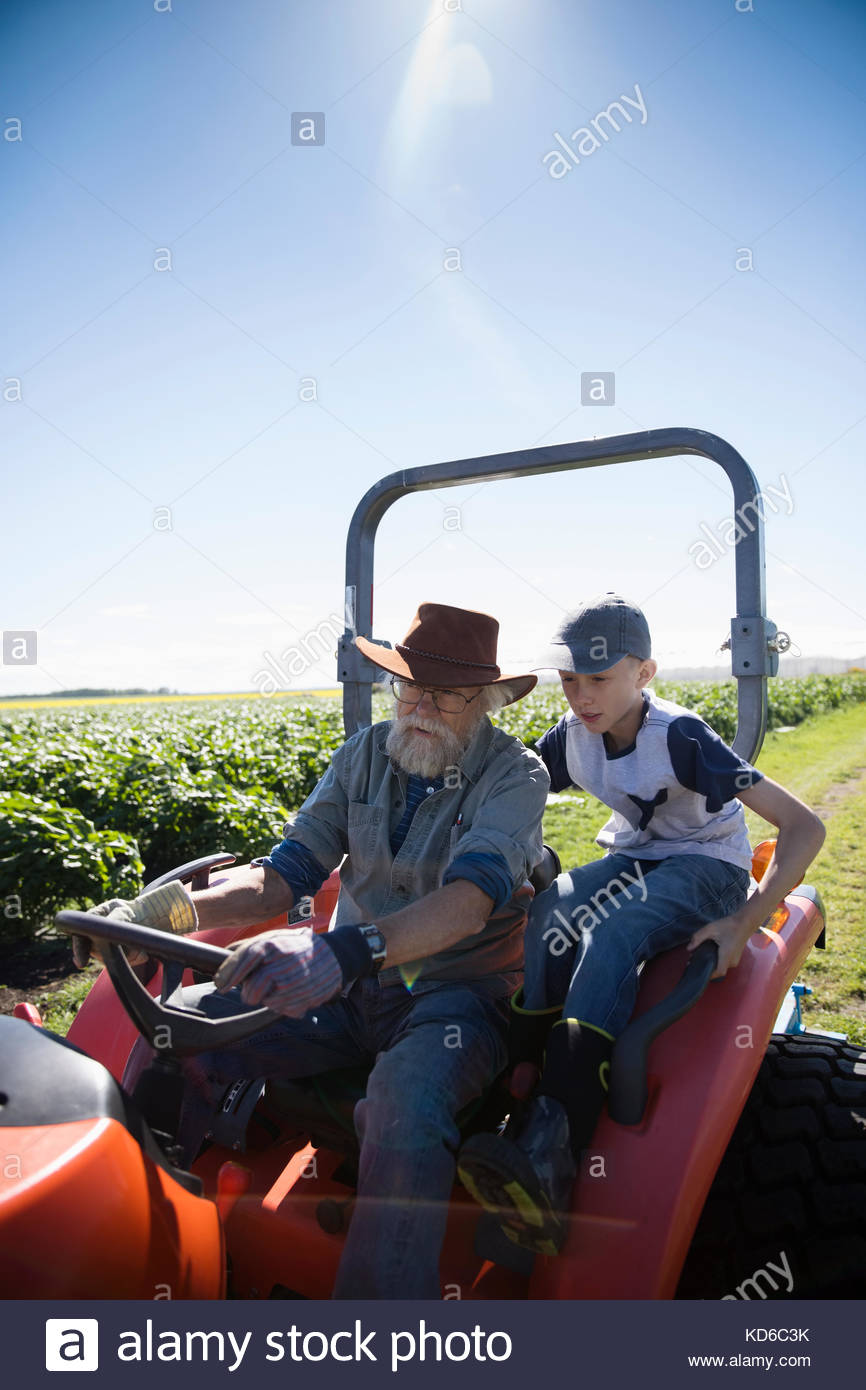 Farmer riding tractor hi-res stock photography and images - Alamy