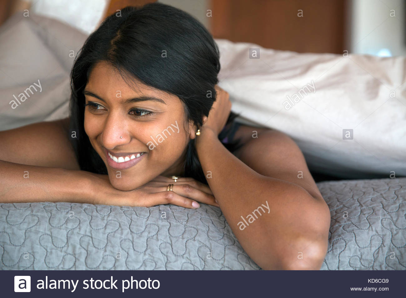 Woman looking under bed hi-res stock photography and images - Alamy