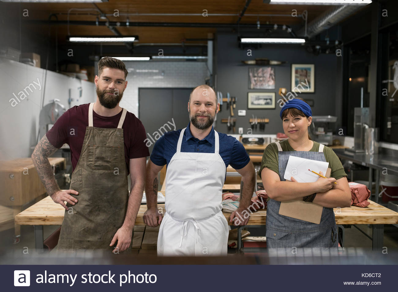 Portrait confident butchers working in butcher Stock Photo - Alamy