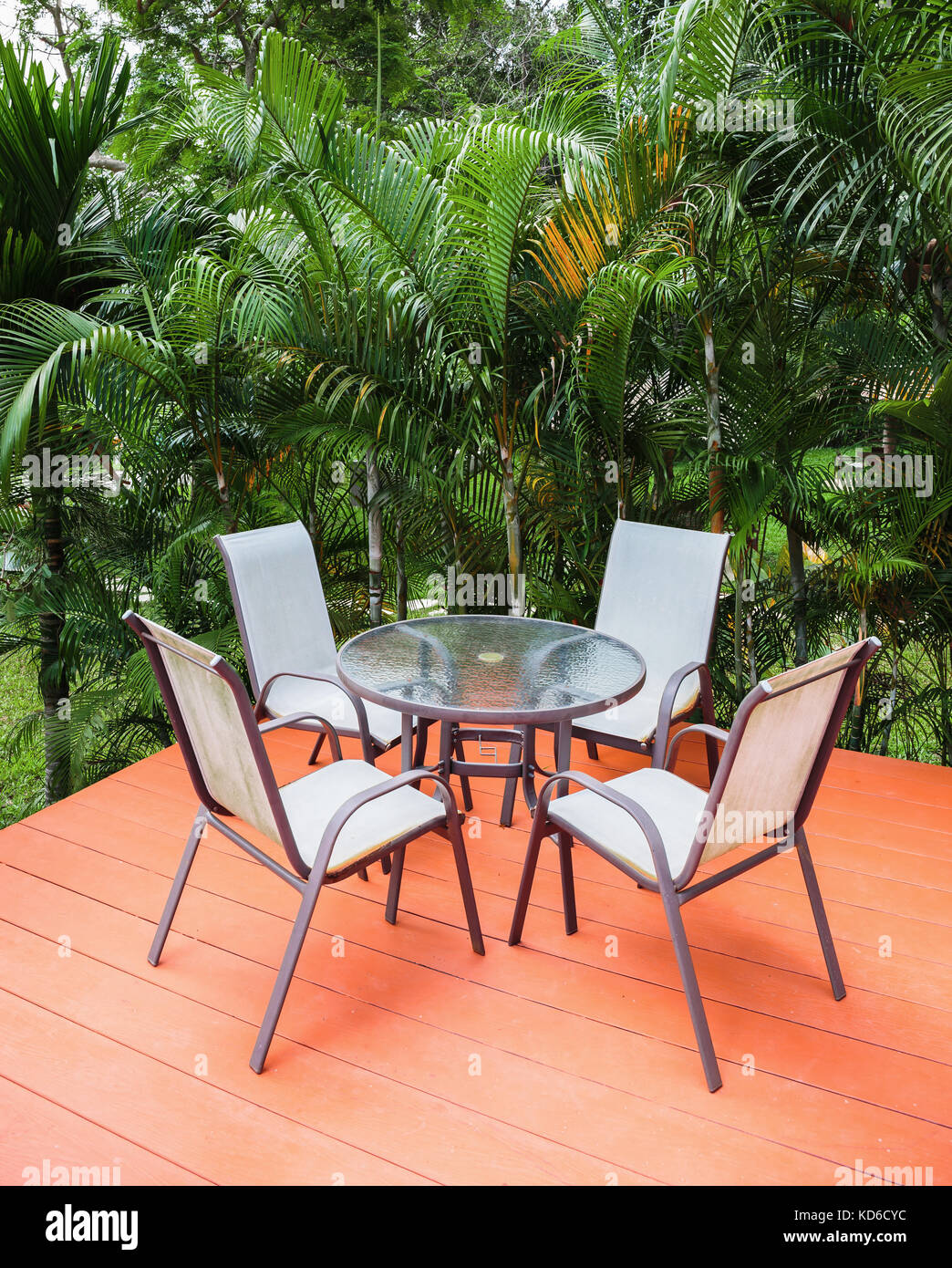 Table and chairs on the terrace in a tropical garden Stock Photo - Alamy