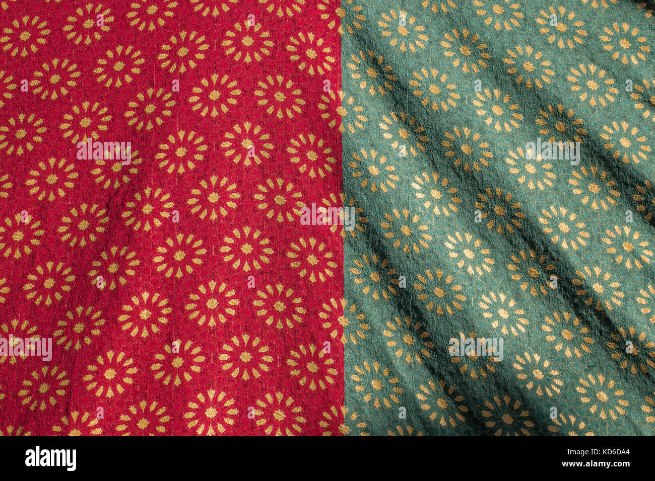 Close up view of Traditional red, green and golden medieval fabric ...